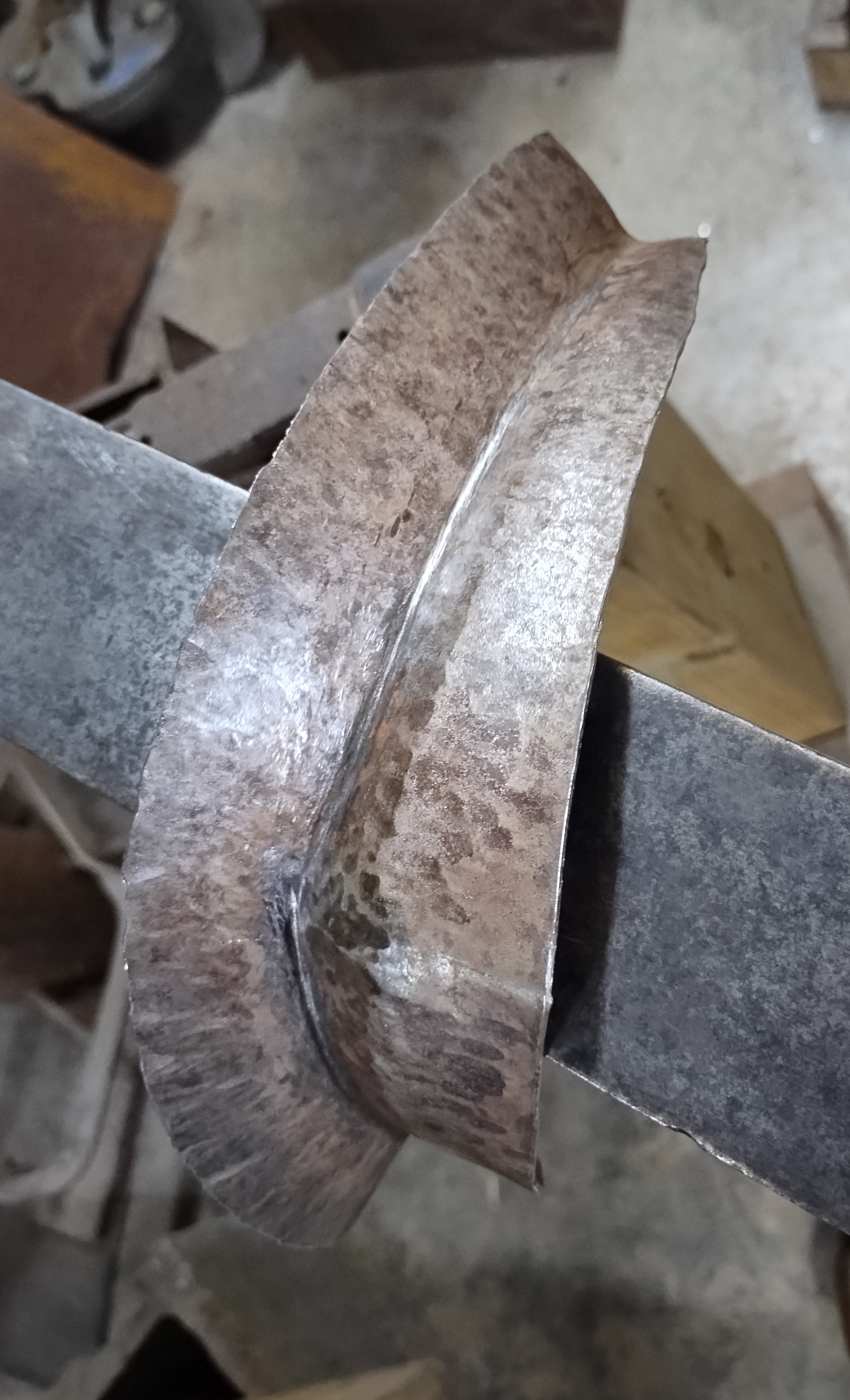 Metal movement in forming armour